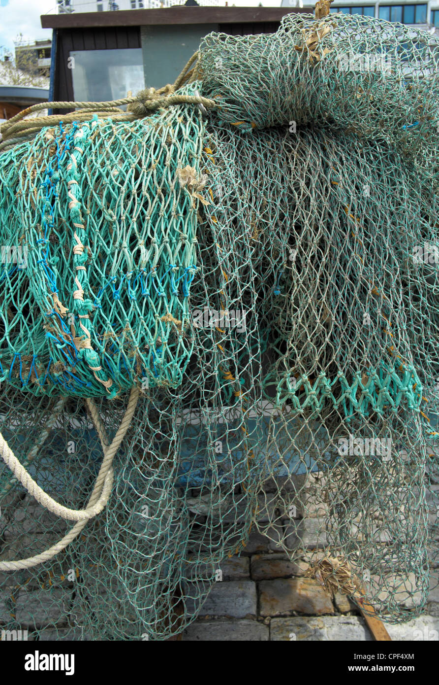 Fishing nets hanging off the back of a boat Stock Photo - Alamy