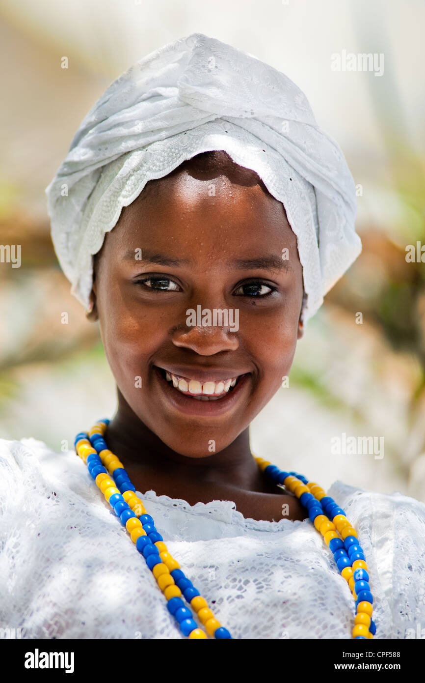 A young Baiana girl smiles during the ritual ceremony in honor to ...
