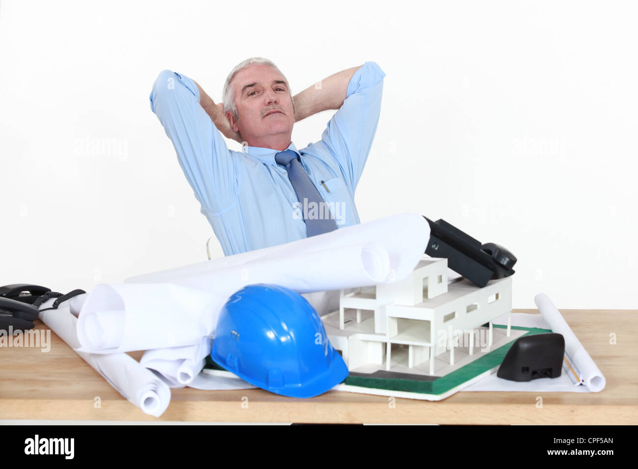 Architect sat at desk Stock Photo - Alamy