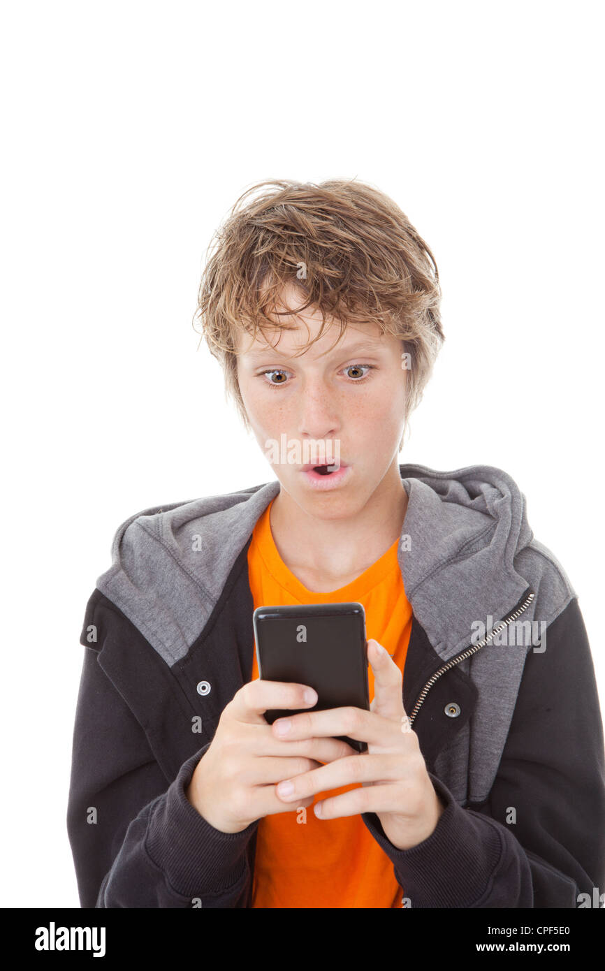 shocked kid reading message on mobile or cell phone Stock Photo - Alamy