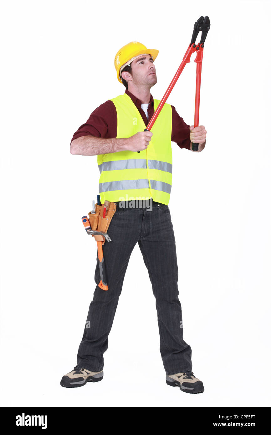 Worker using bolt cutters Stock Photo - Alamy