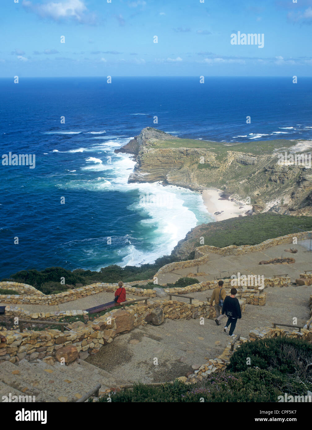Tourists walking down coastal steps on cliff top. Cape of Good Hope ...