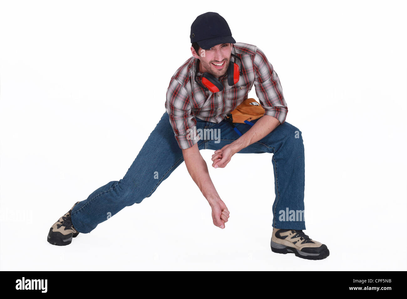 craftsman bending down Stock Photo - Alamy