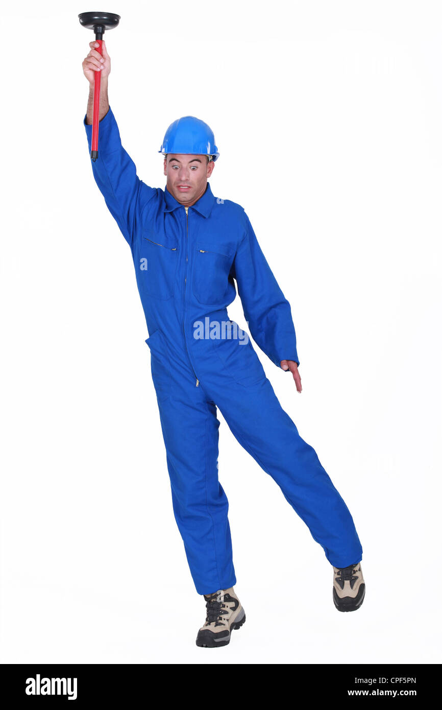 Plumber with plunger in hand Stock Photo - Alamy