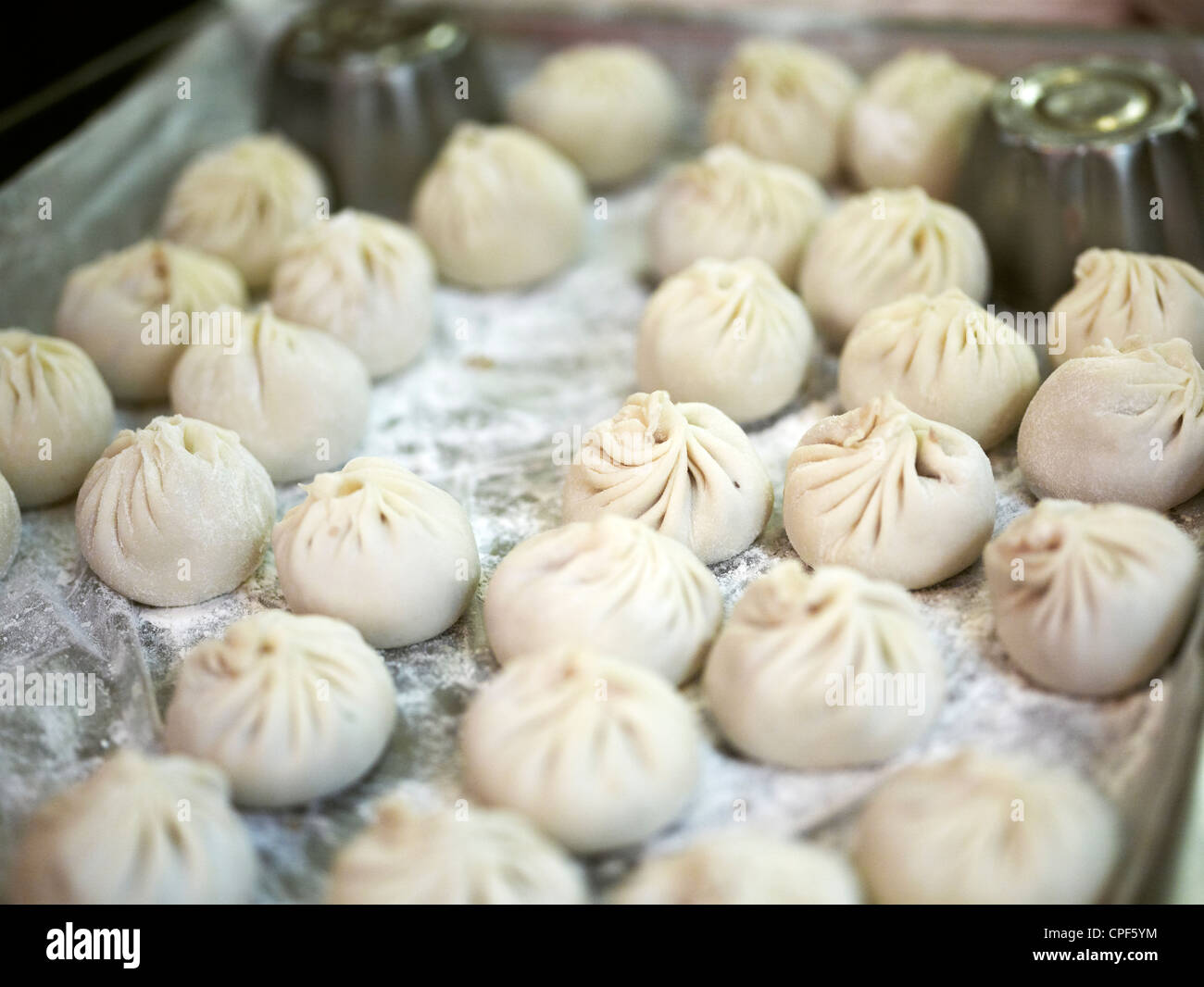 Dumplings, a traditional Chinese delicacy, being prepared by a street ...