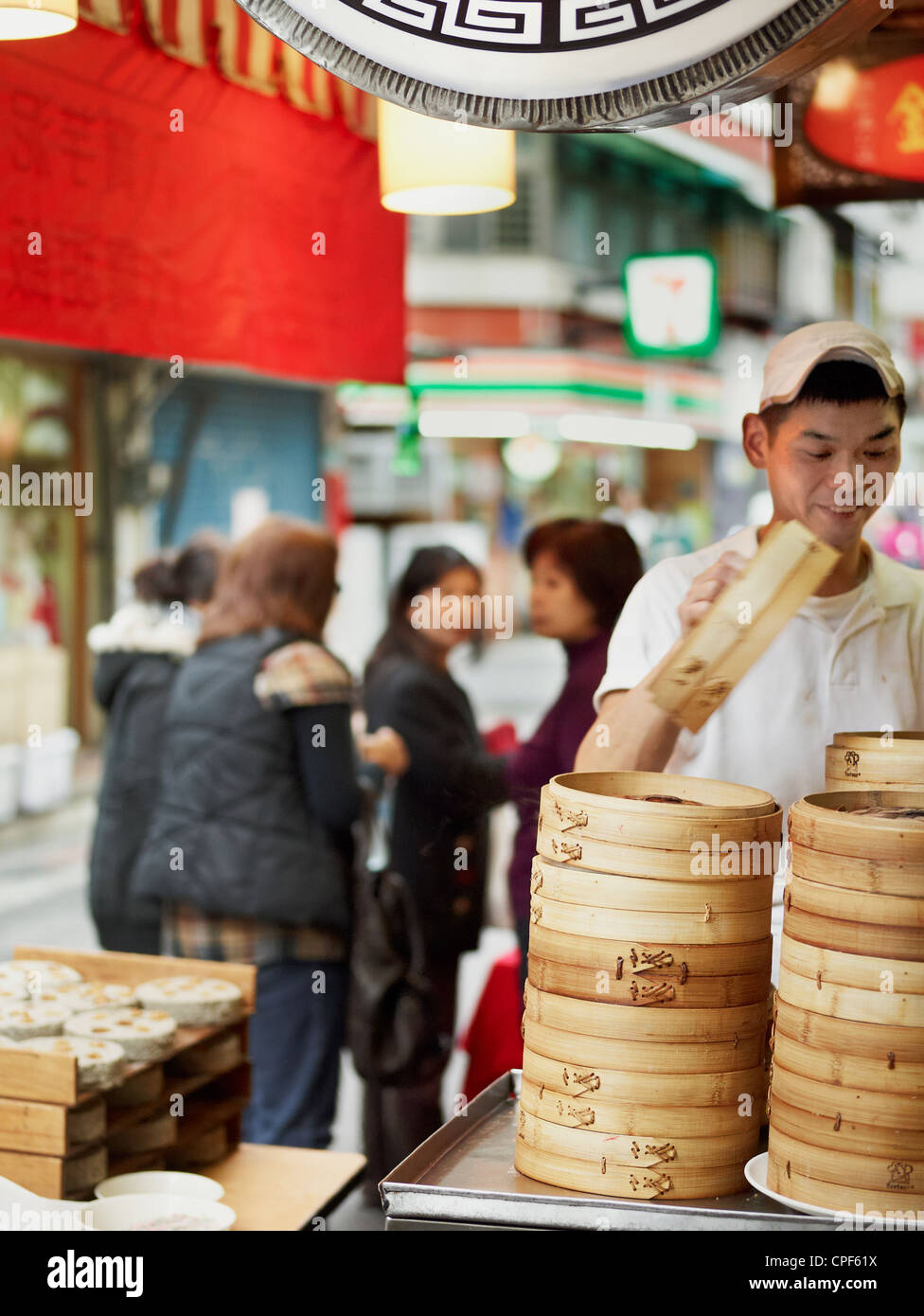 Dumplings, a traditional Chinese delicacy, being prepared by a street ...