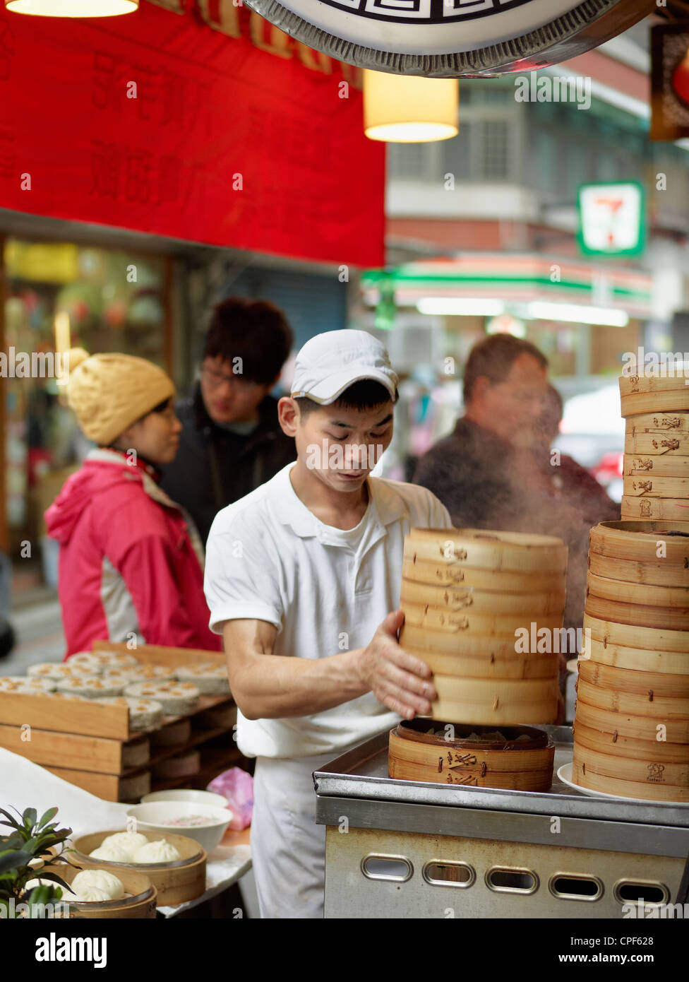 Dumplings, a traditional Chinese delicacy, being prepared by a street ...