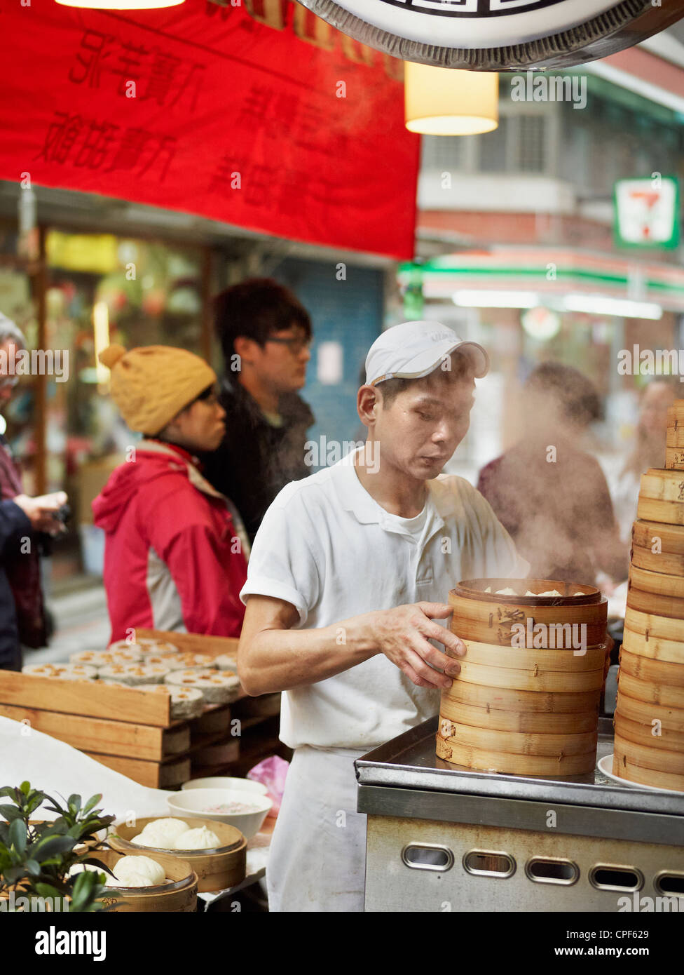Dumplings, a traditional Chinese delicacy, being prepared by a street ...