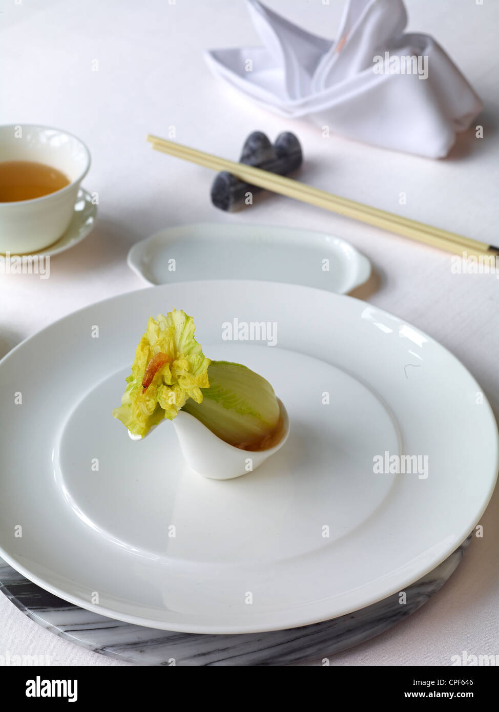 A "Jadeite Cabbage" created with Bok Choy topped with Shrimp. A ...