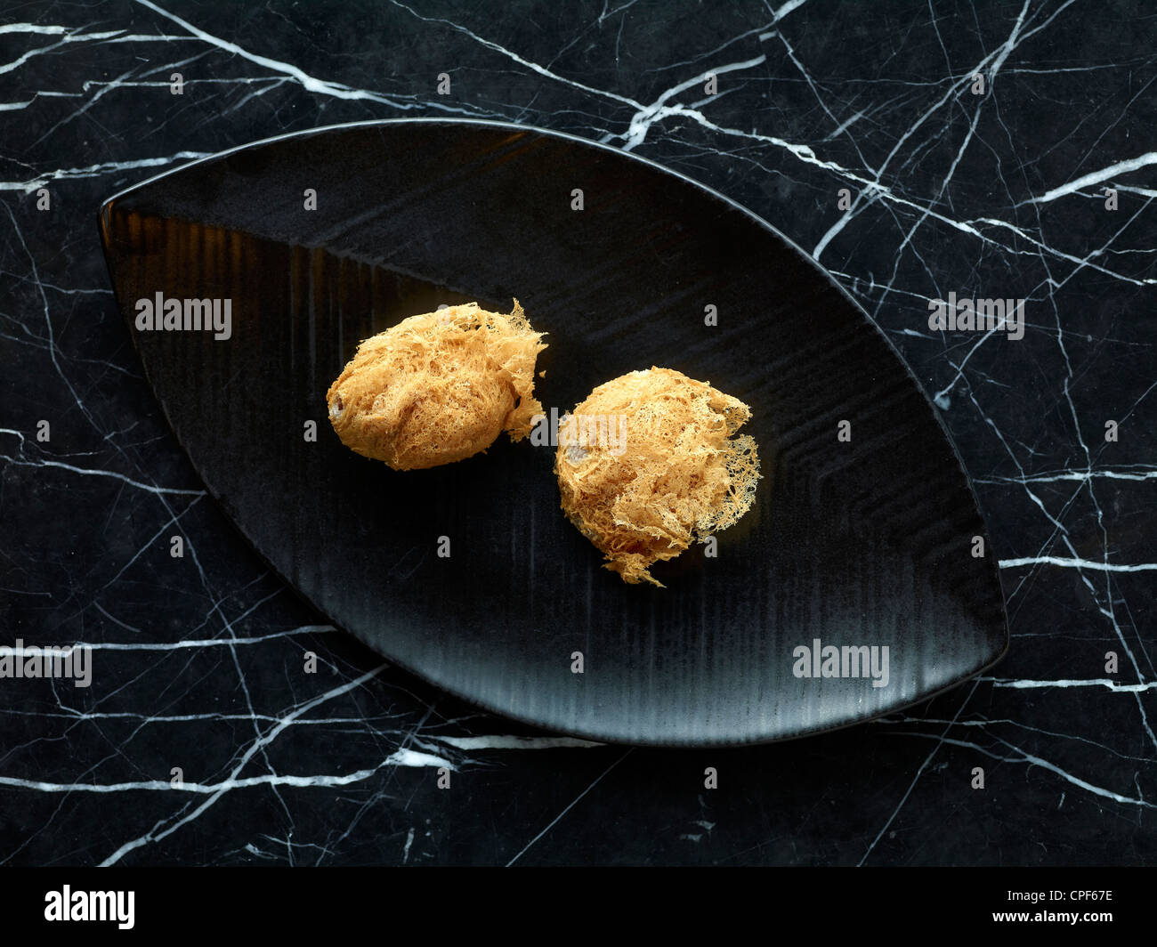 A fried Taro Puff Ball, or Wu Gok, a fried puff ball consisting of taro ...