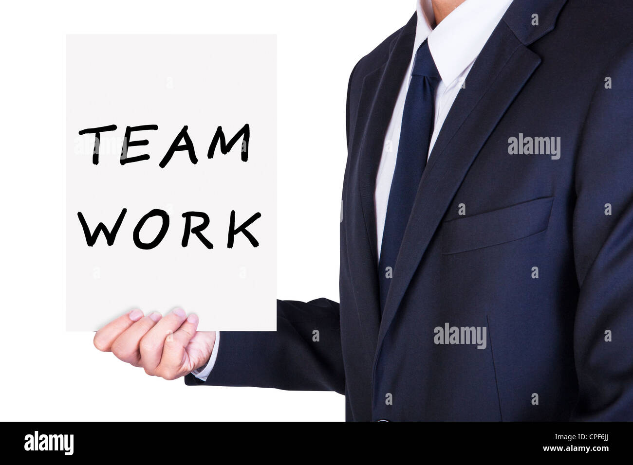 Businessman holding paper written teamwork in hand Stock Photo - Alamy