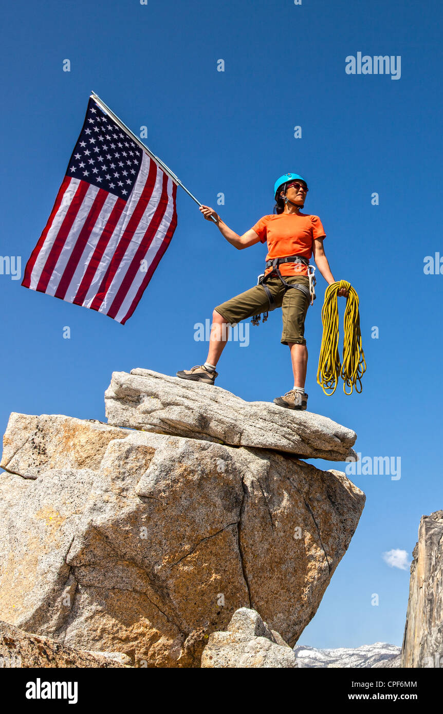 Climber waves an American flag on the summit Stock Photo - Alamy