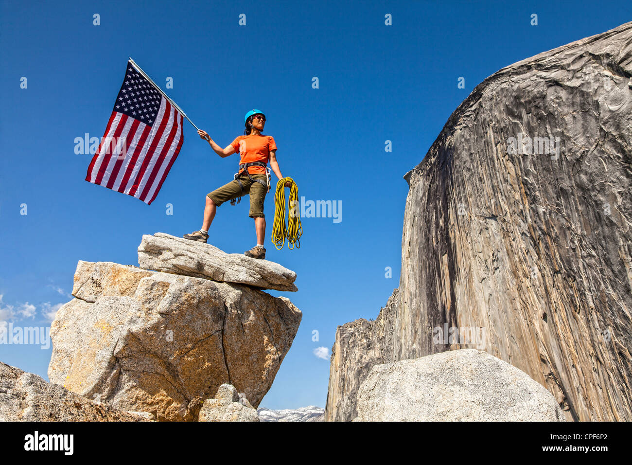 Climber waves an American flag on the summit Stock Photo - Alamy