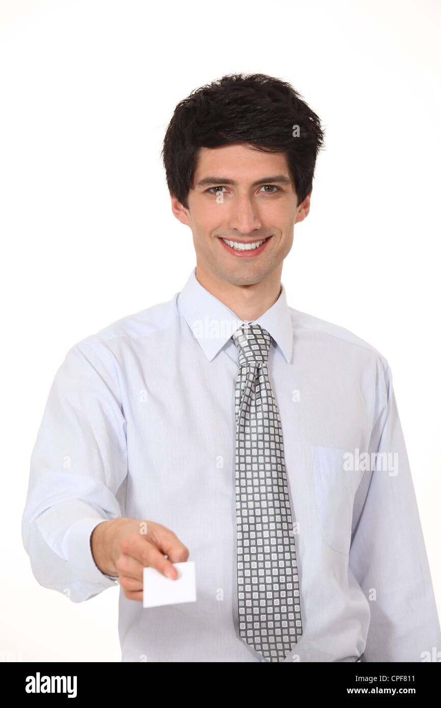 Smiling businessman offering his business card Stock Photo - Alamy