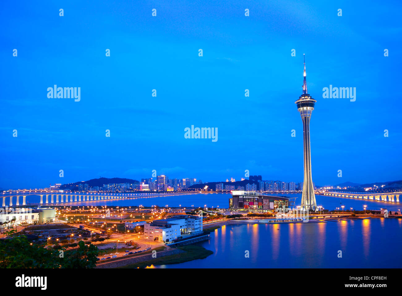 Urban landscape of Macau with famous traveling tower under blue sky ...
