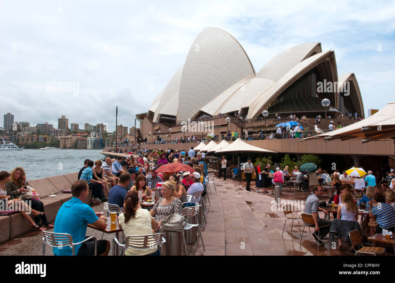 Restaurant and umbrellas in area of famous Sydney Opera House in ...