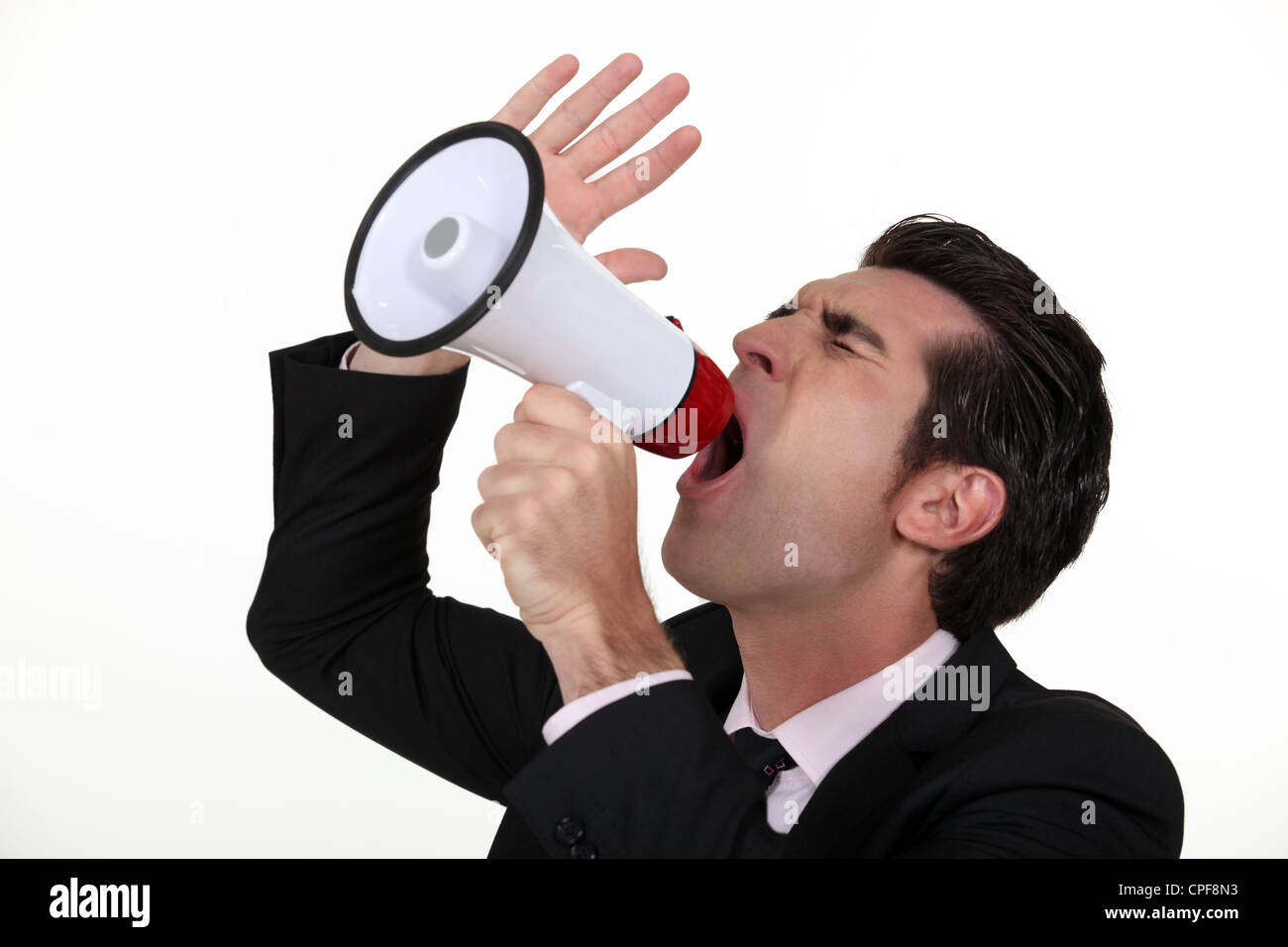Man shouting through megaphone Stock Photo - Alamy