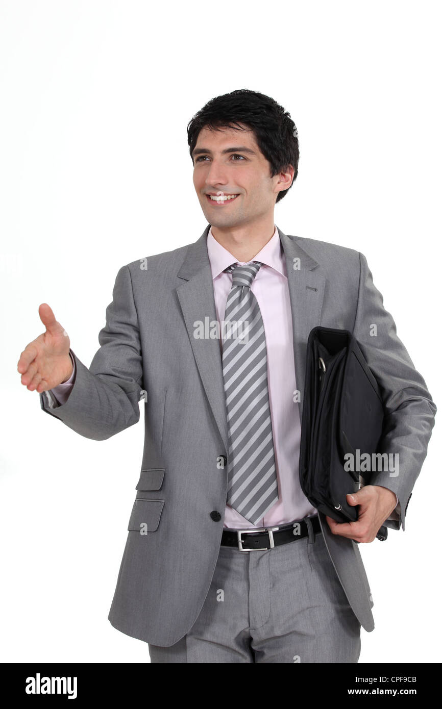 Businessman offering his hand Stock Photo - Alamy