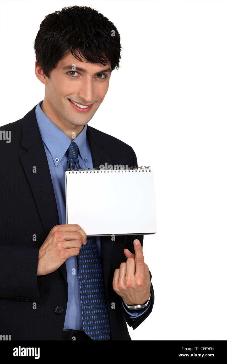 Businessman pointing to a blank notepad Stock Photo - Alamy