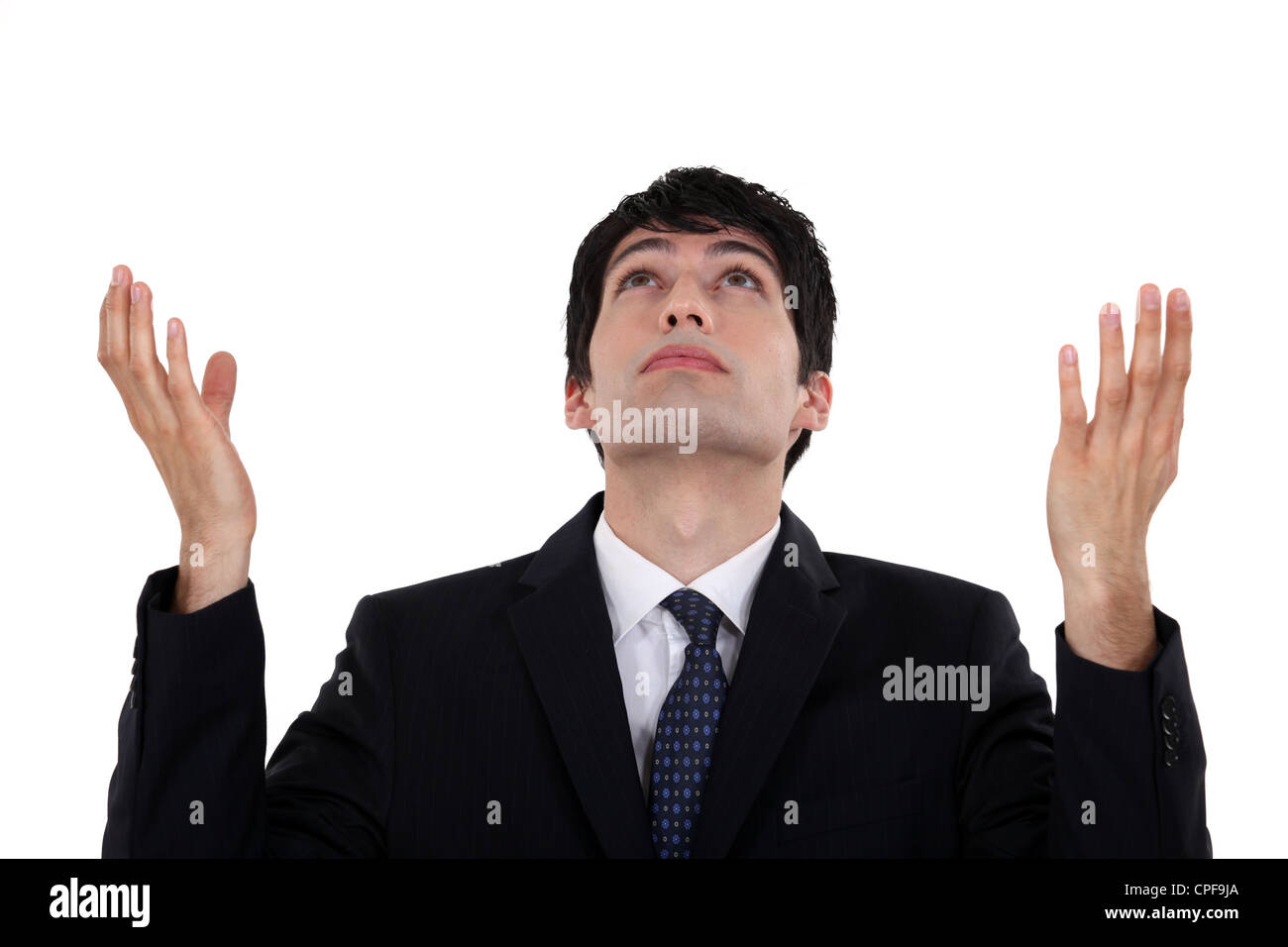 Man looking up with hands up Stock Photo - Alamy