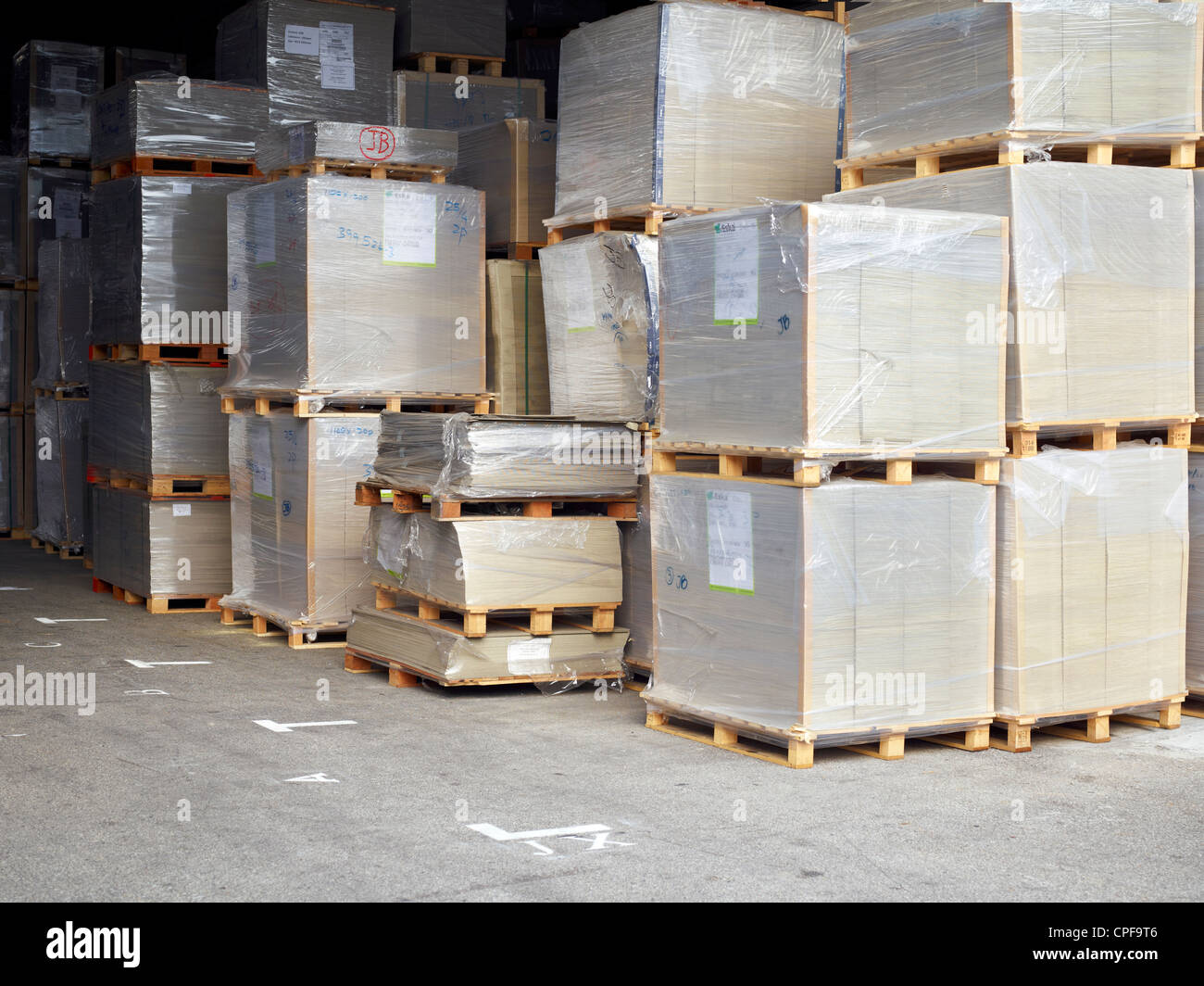 Stacked palettes at cardboard at a printing press in Malaysia. April 28 ...