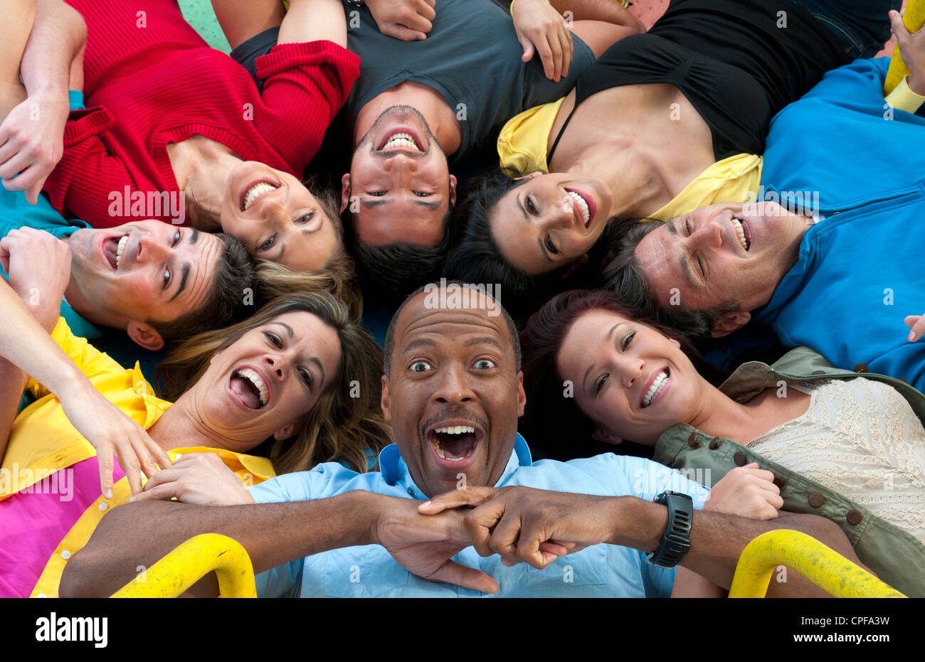 Abstract from above of many multi ethnic friends in playground laughing ...