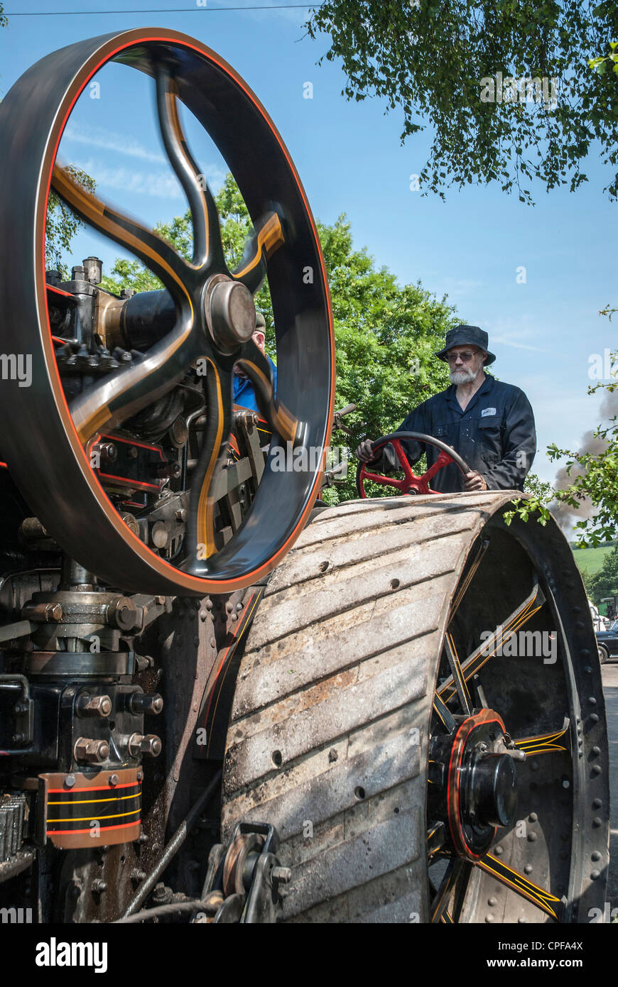 Steam engine on the move with driver Stock Photo - Alamy