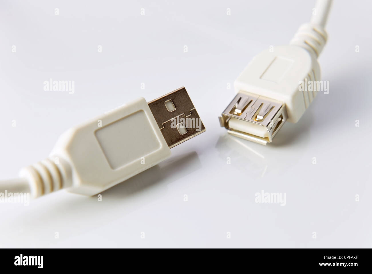 USB cable on white reflective background . Macro shot Stock Photo - Alamy