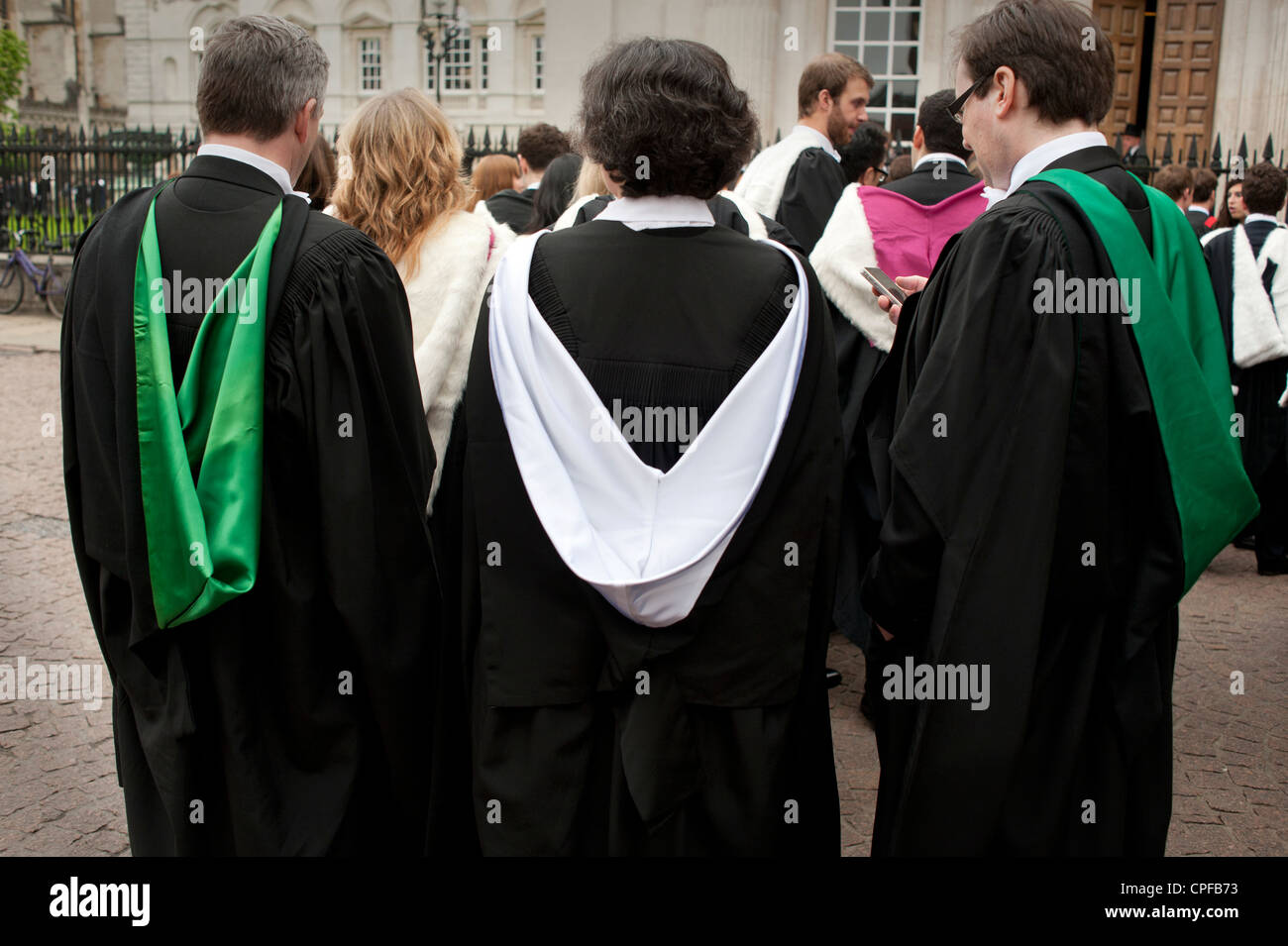 Cambridge University students queue outside the senate house waiting to ...