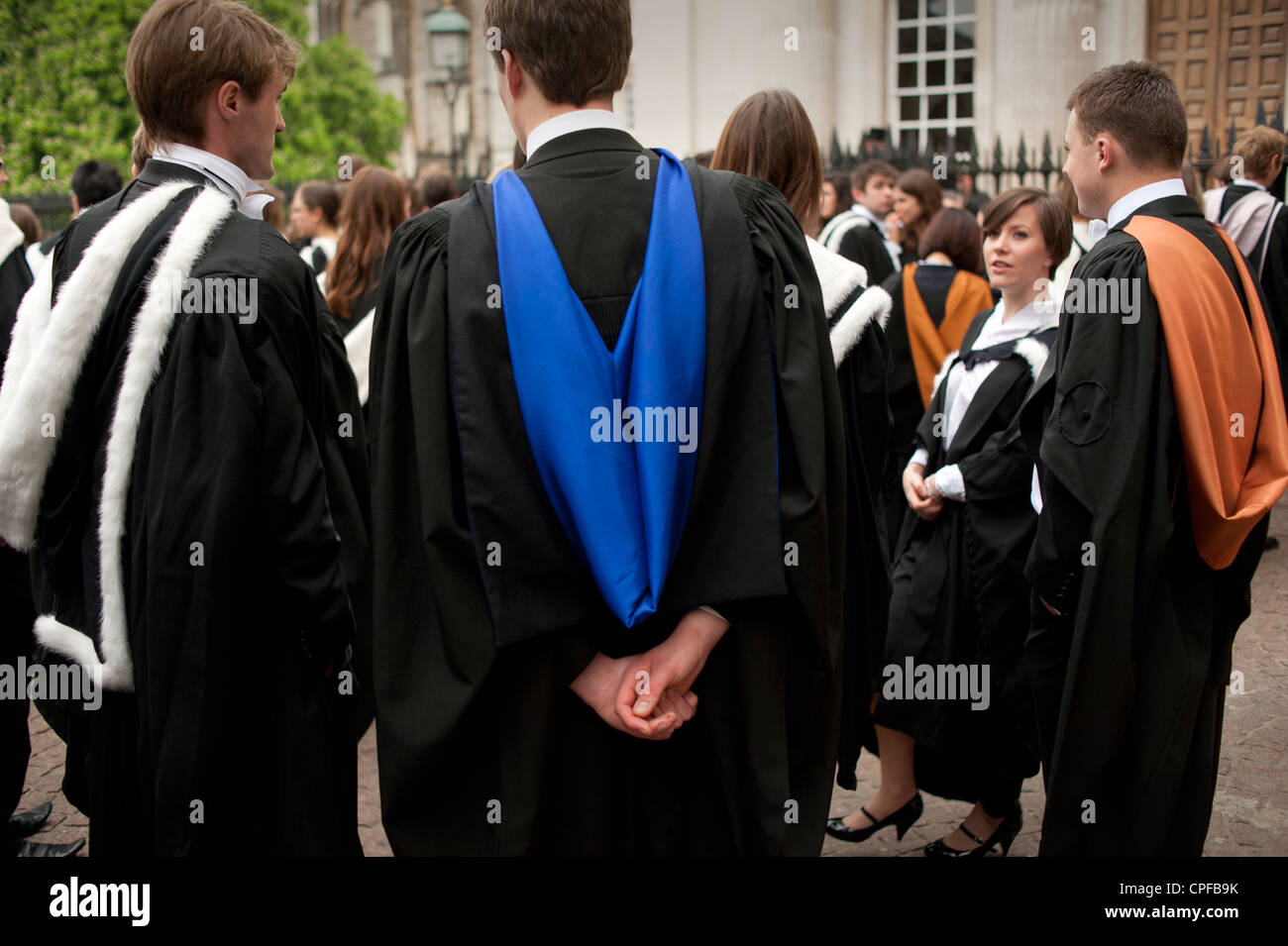 Cambridge University students queue outside the senate house waiting to ...