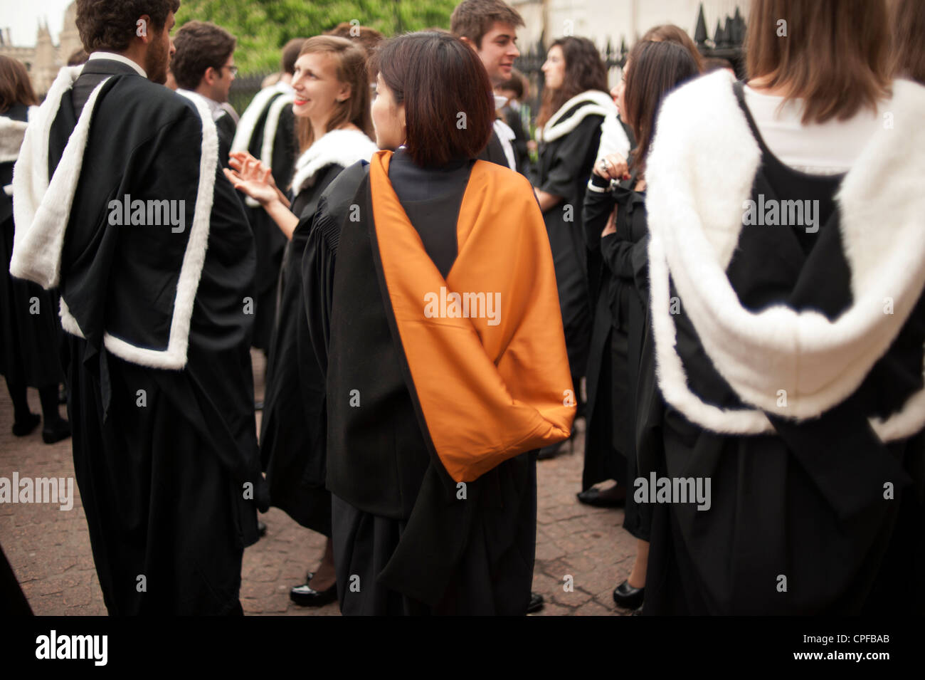 Cambridge University students queue outside the senate house waiting to ...
