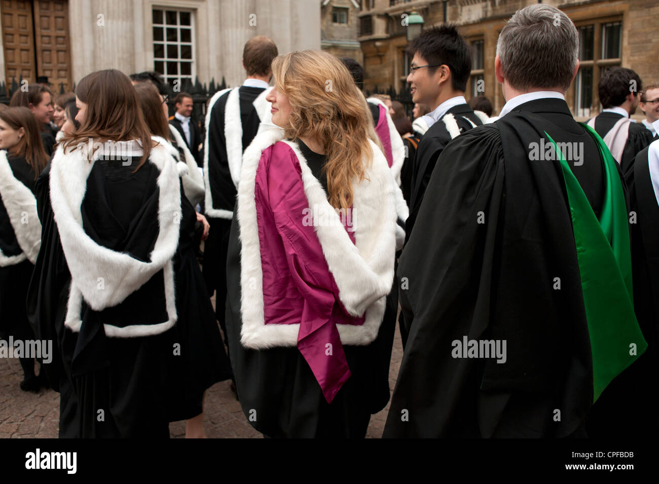 Cambridge University students queue outside the senate house waiting to ...