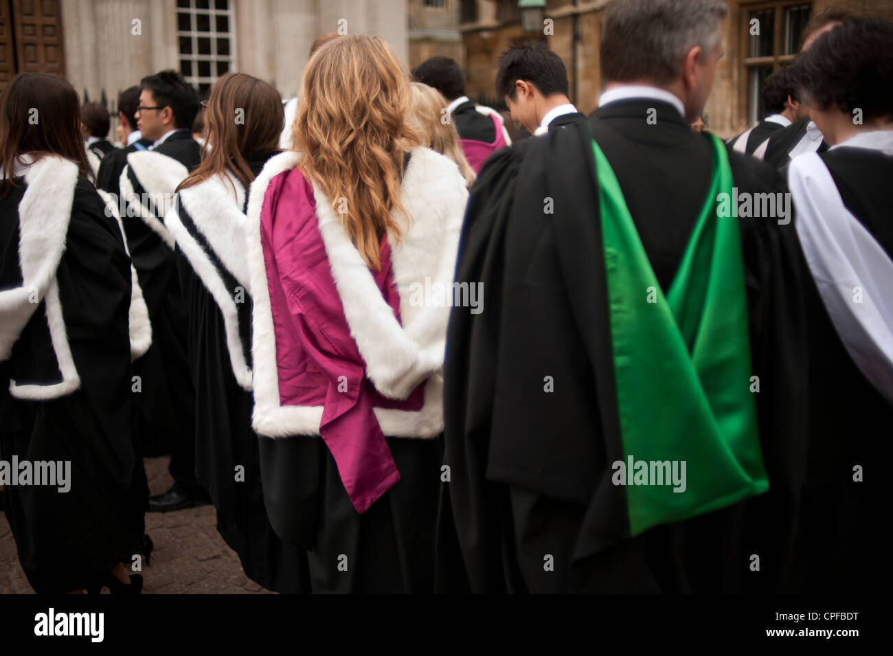 Cambridge University students queue outside the senate house waiting to ...