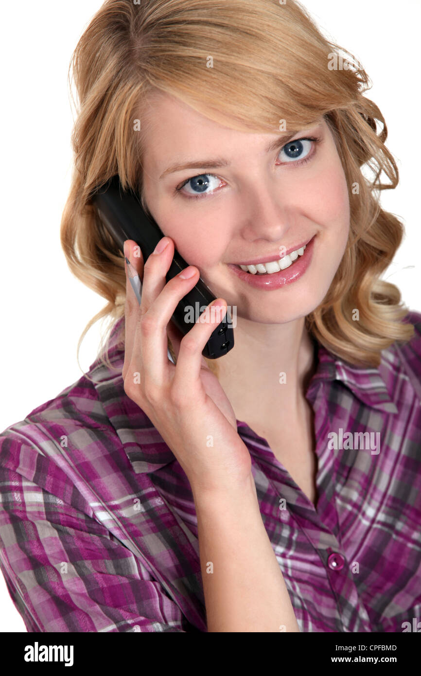 Attractive woman talking on the telephone Stock Photo - Alamy