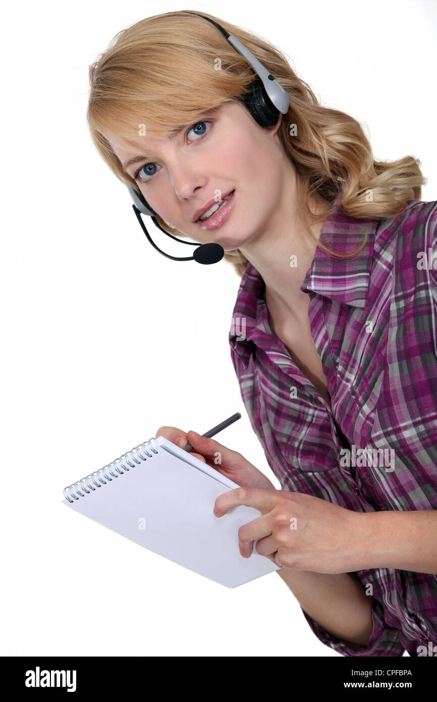 Woman writing in notebook Stock Photo - Alamy