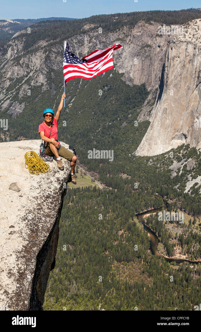Climber waves an American flag on the summit Stock Photo - Alamy