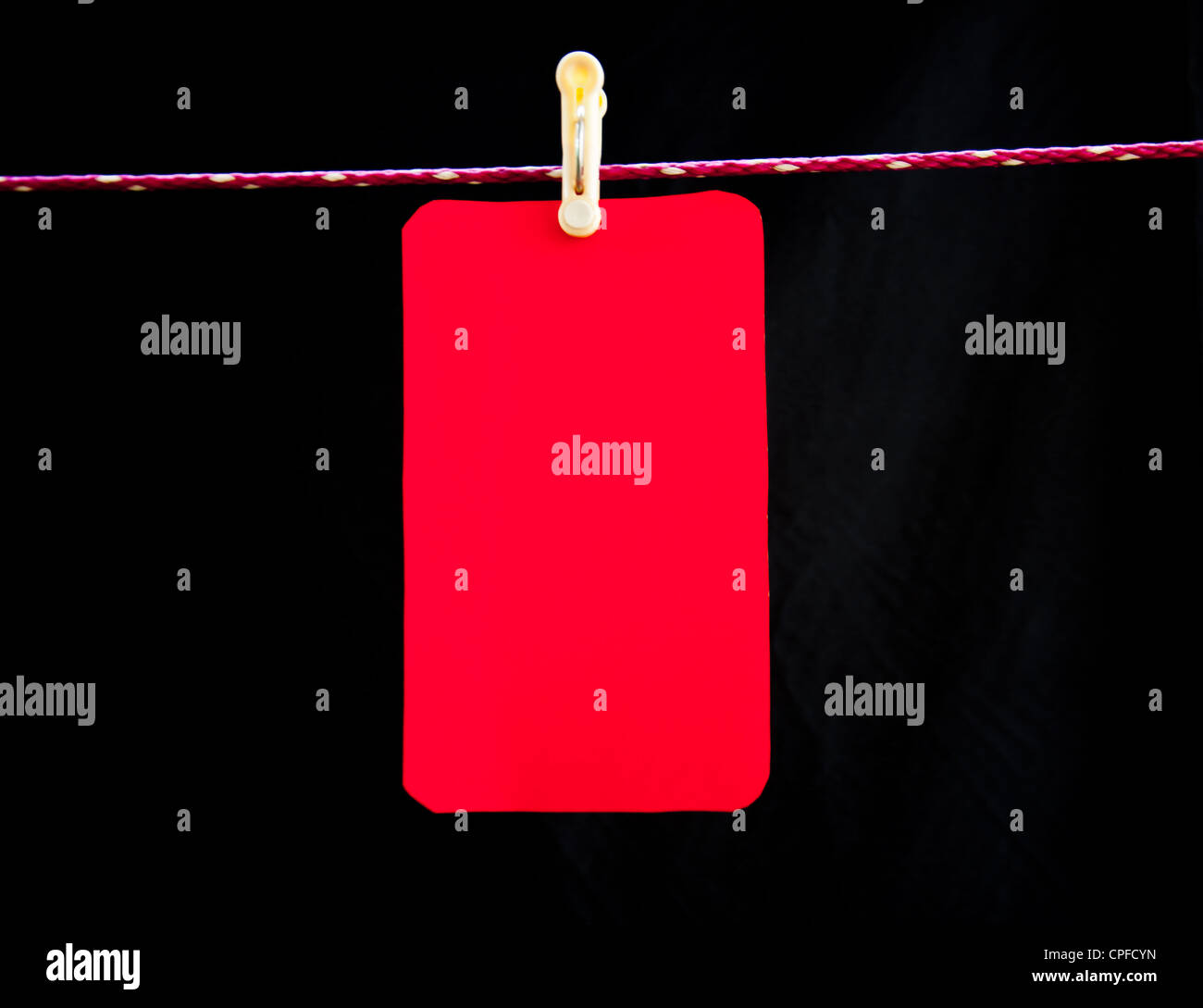 red hang paper on black background Stock Photo - Alamy