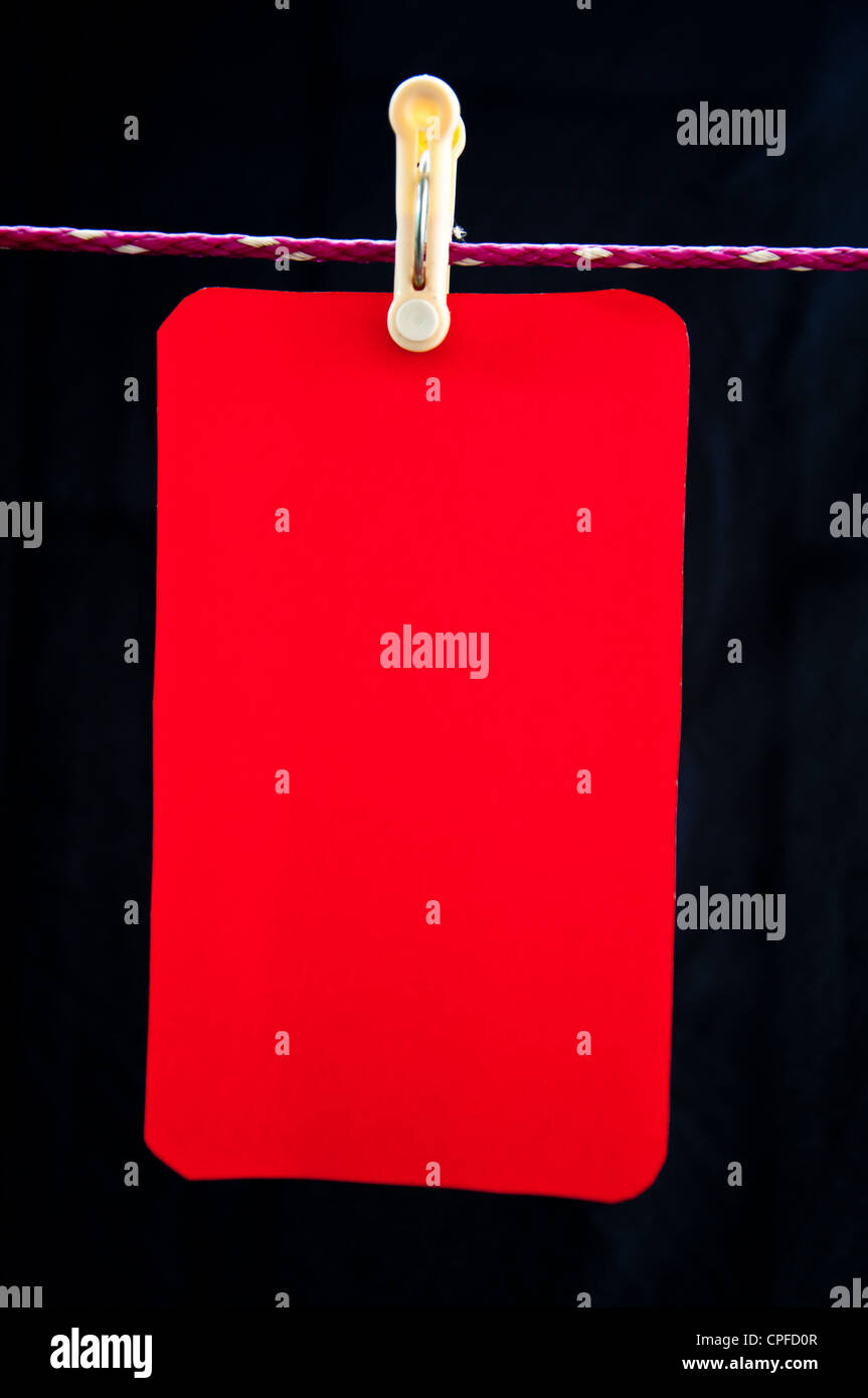 red hang paper on black background Stock Photo - Alamy