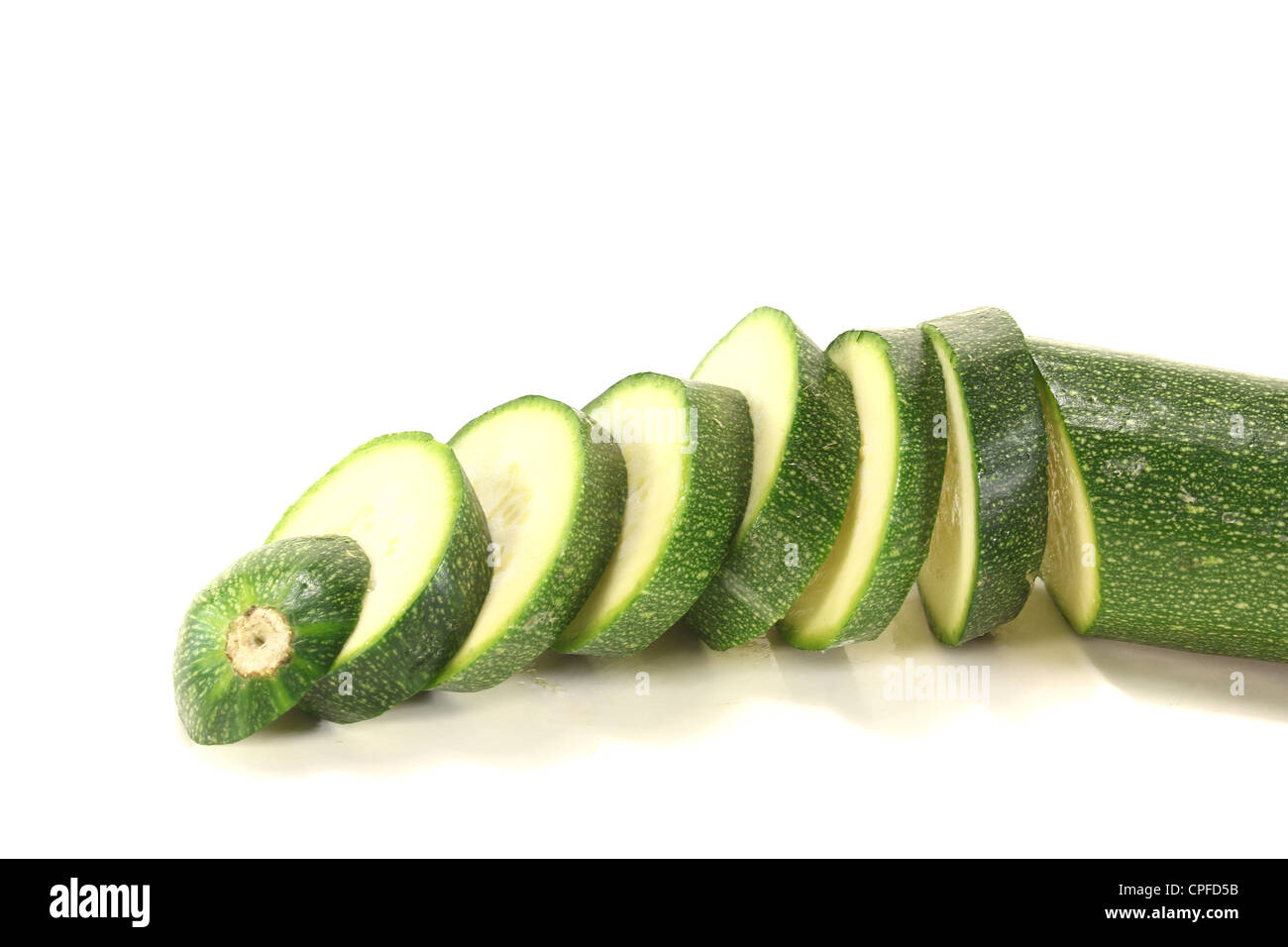 fresh sliced green Courgette on a light background Stock Photo - Alamy