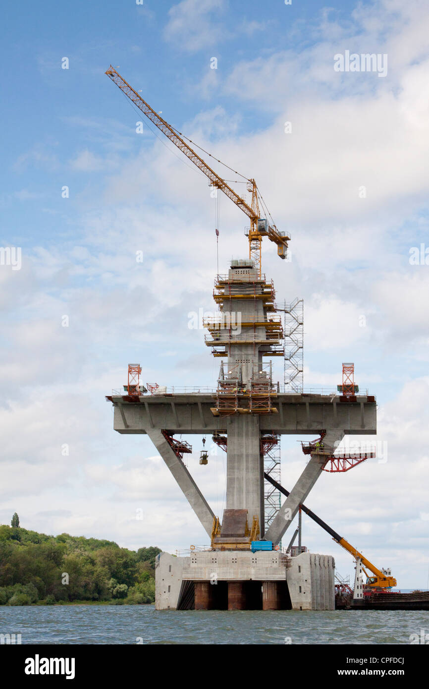 Half-finished bridge pylon with crane in the Danube, construction site ...