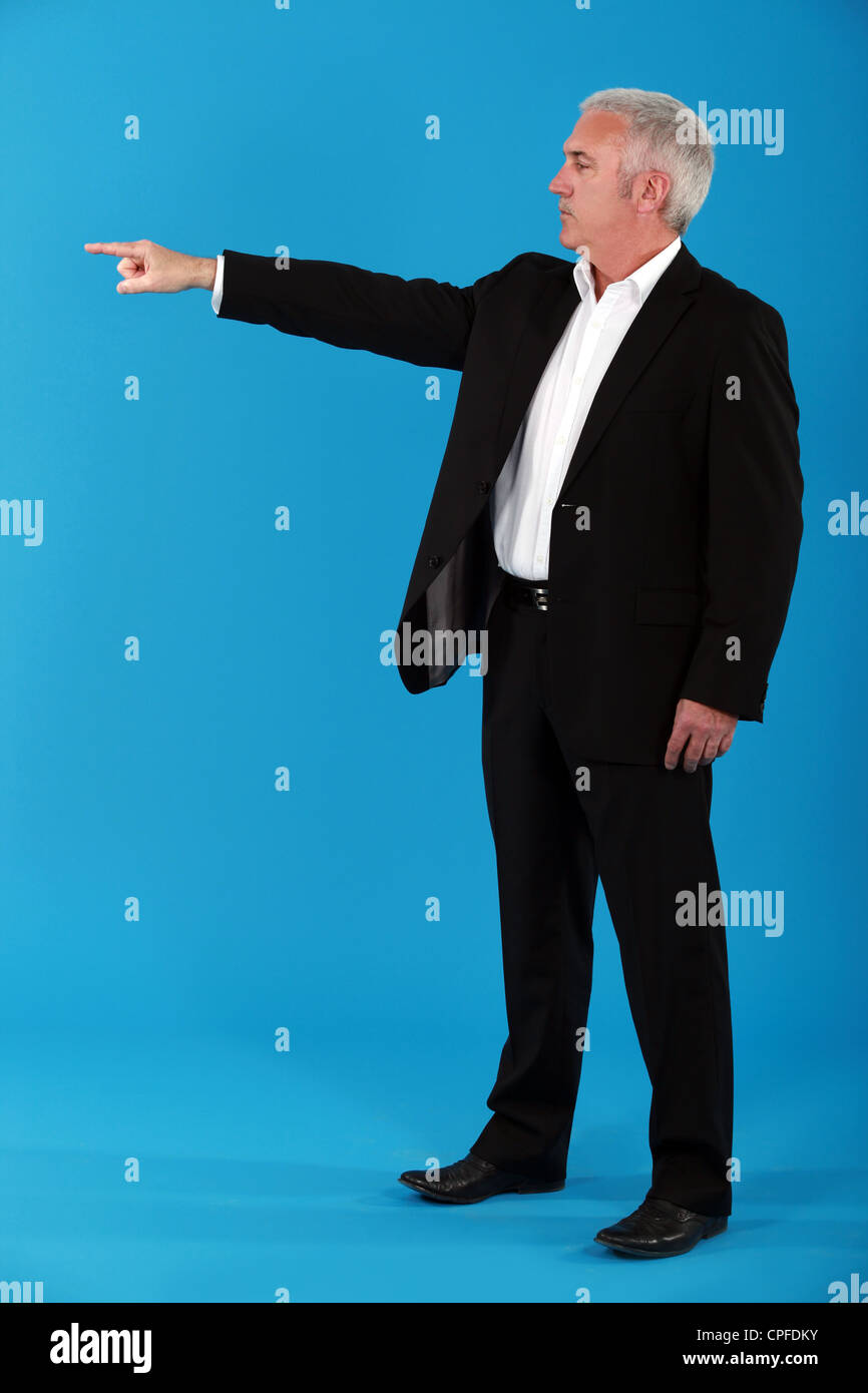 Senior man pointing to the front Stock Photo - Alamy