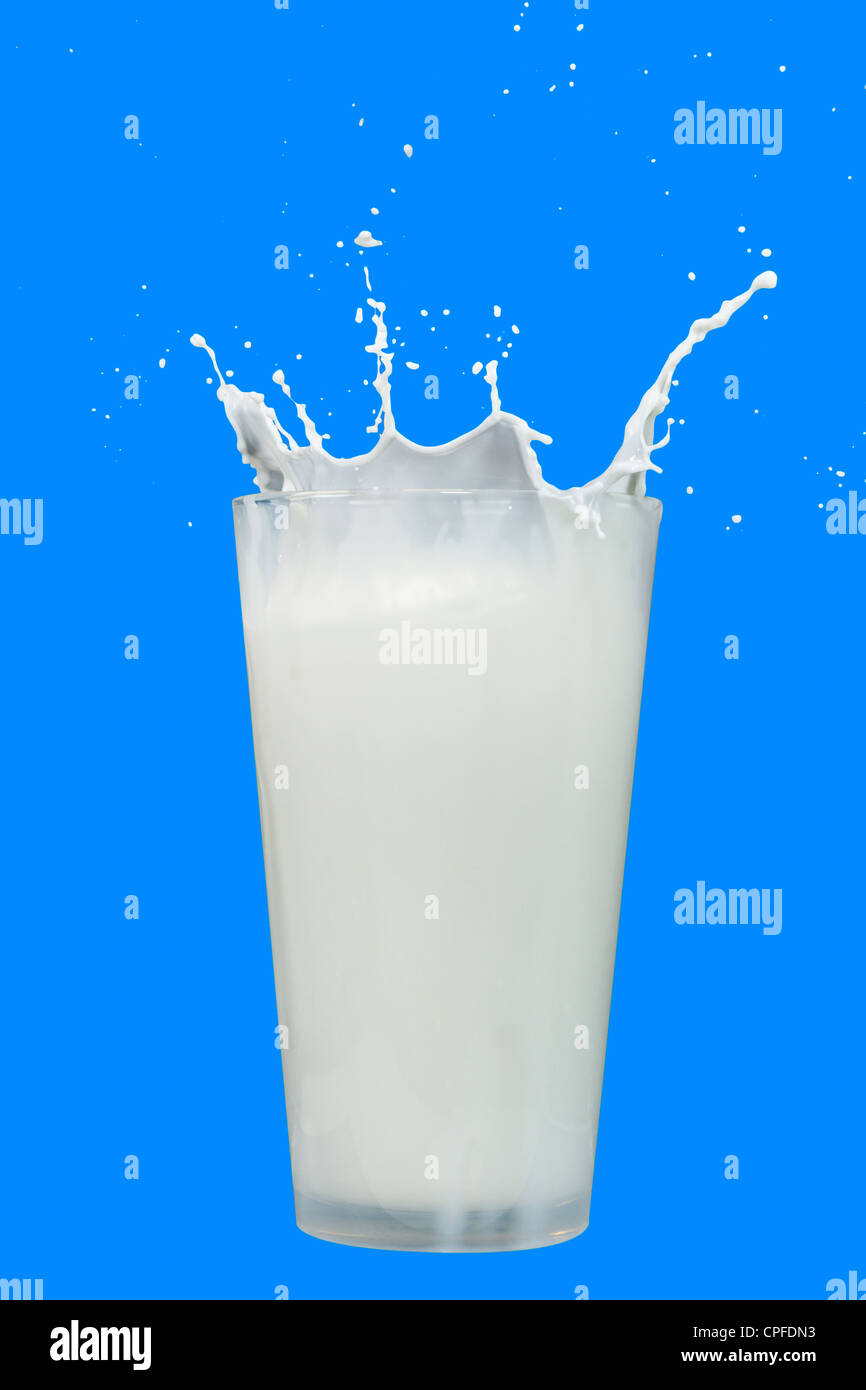 milk splashing from the glass Stock Photo - Alamy