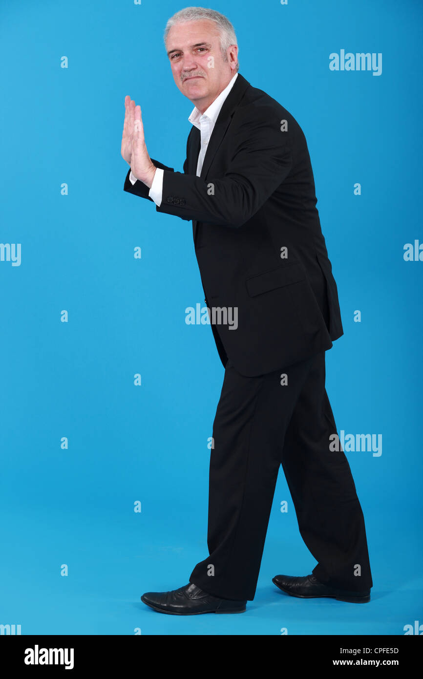 Businessman making stop gesture Stock Photo - Alamy