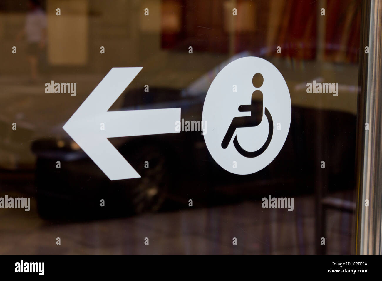 A disabled access sign on an office window Stock Photo - Alamy