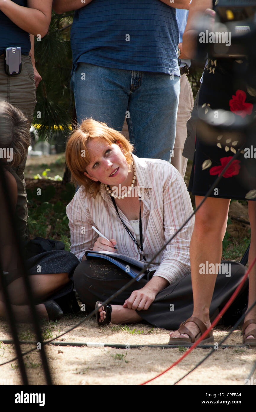 reporter listening to press conference after the 35W bridge collapse ...