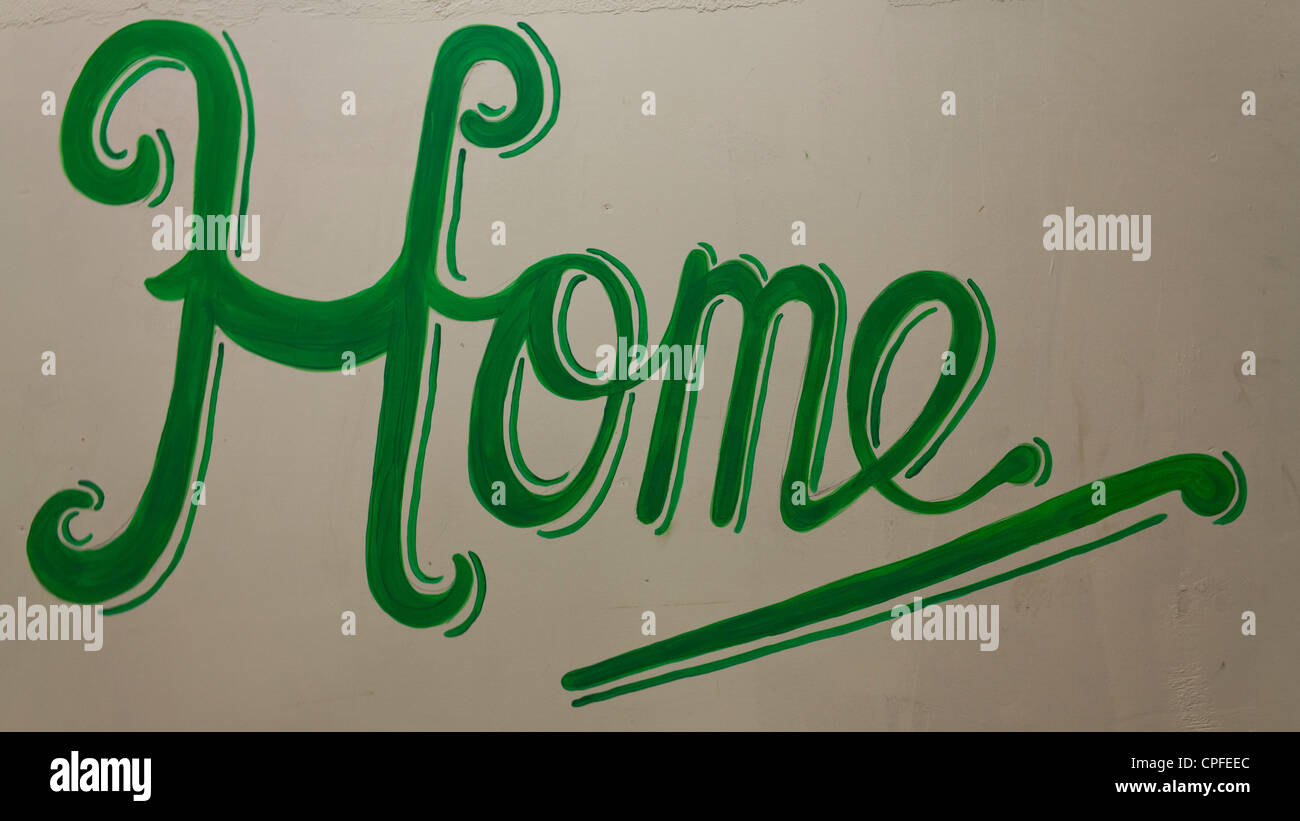 The word 'Home' as painted on a wall in green Stock Photo - Alamy