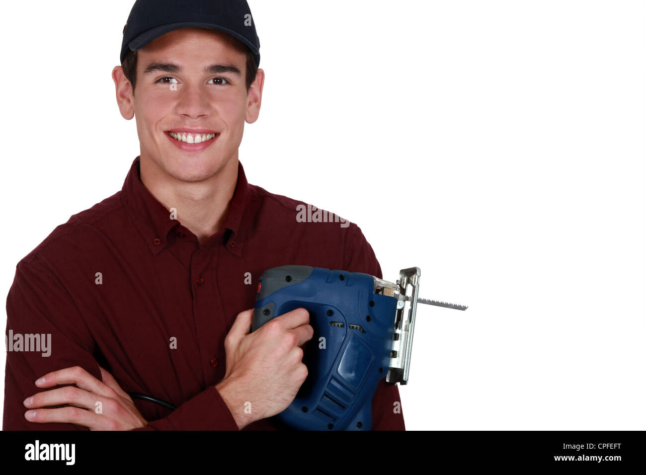 Young man holding a jigsaw Stock Photo - Alamy