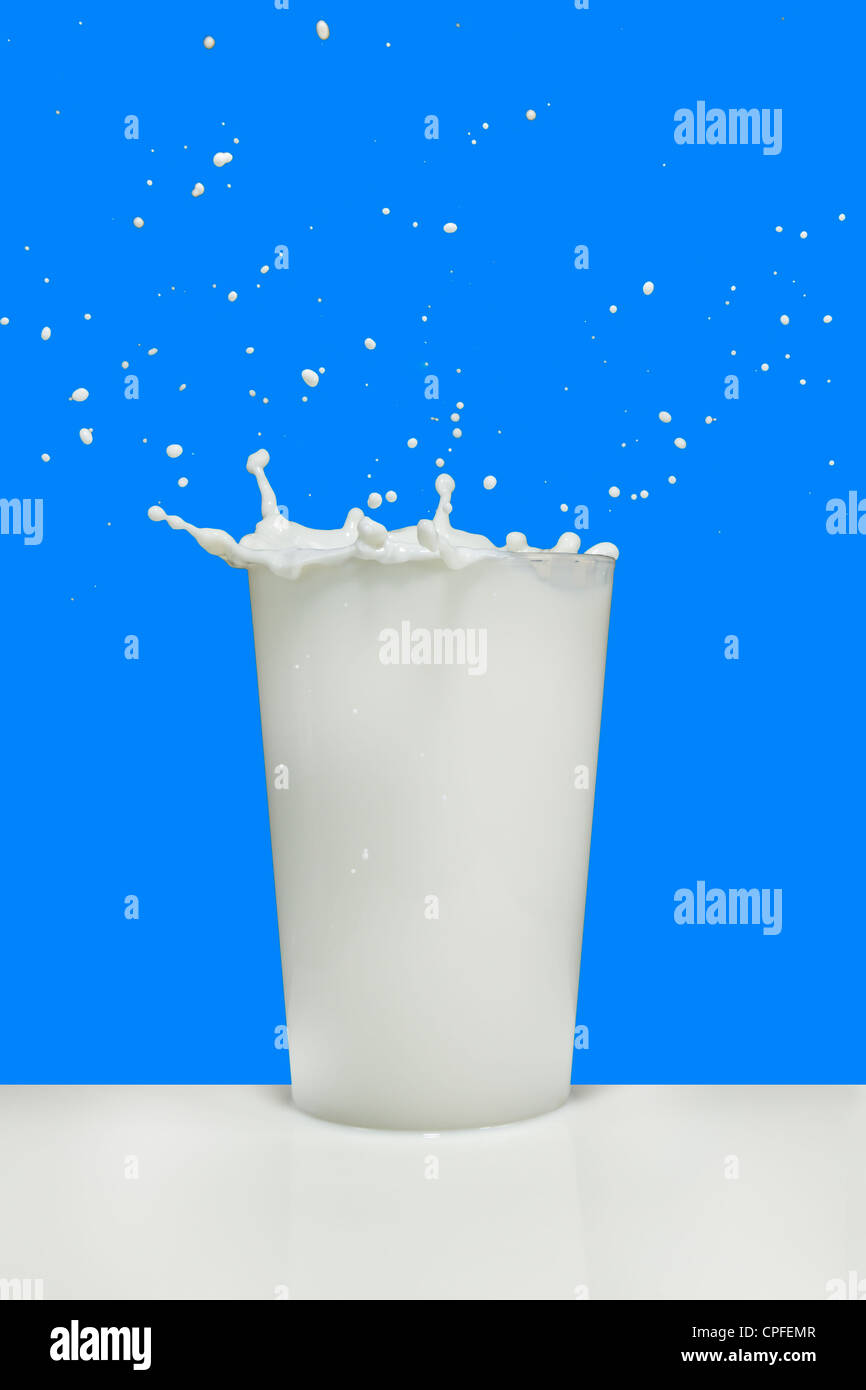 milk splashing from the glass Stock Photo - Alamy