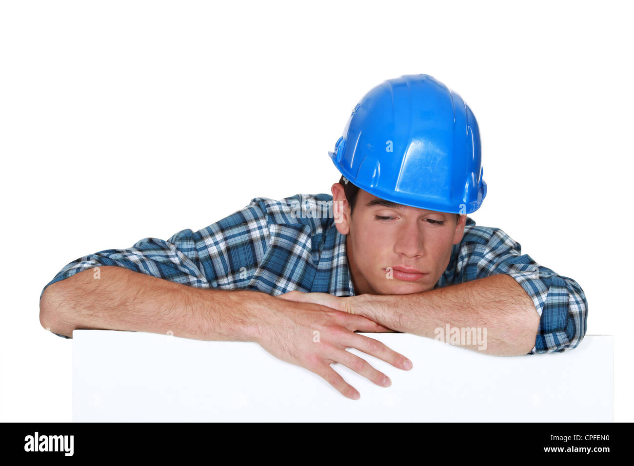 Sleepy construction worker Stock Photo - Alamy
