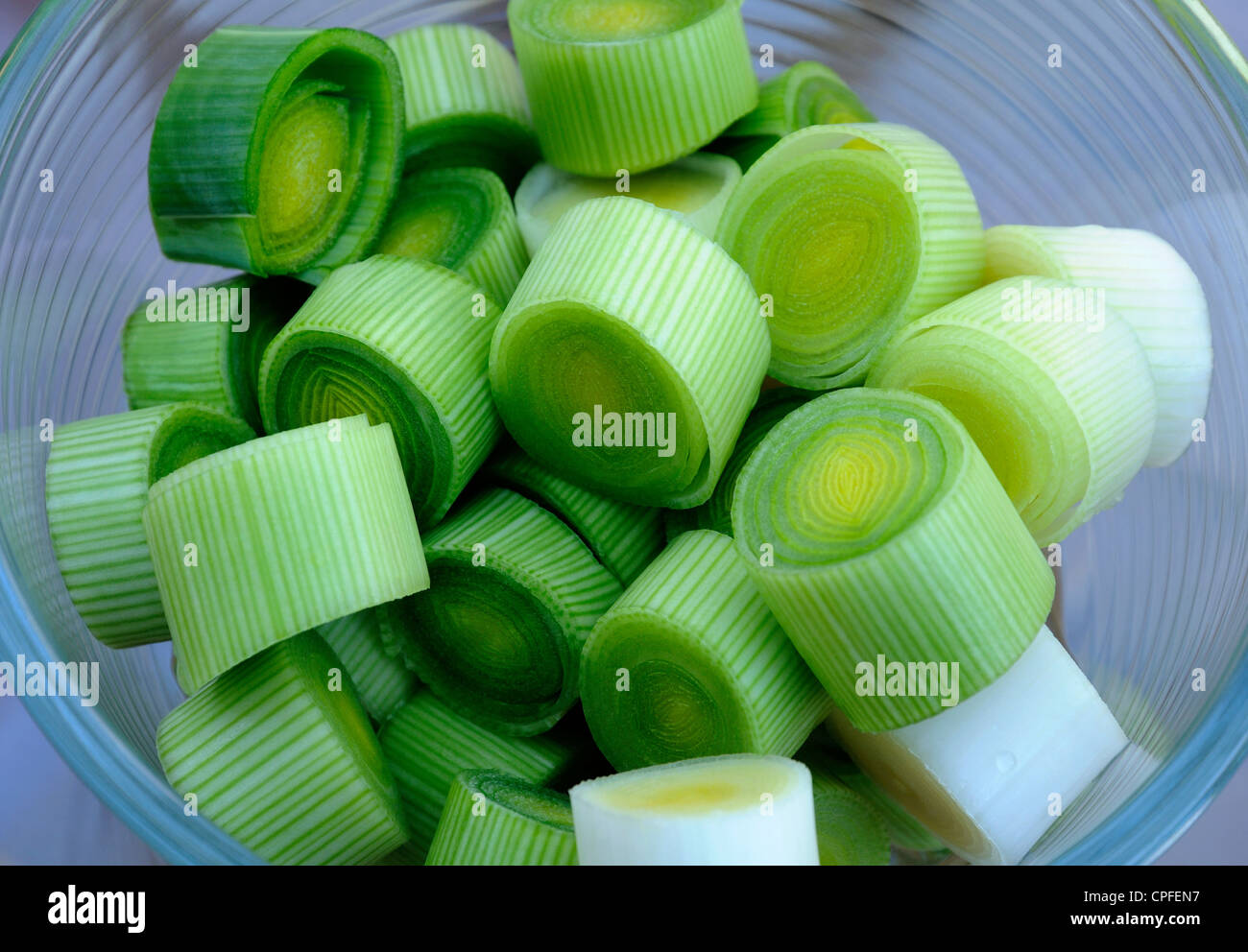 sliced leeks in glass bowl Stock Photo - Alamy